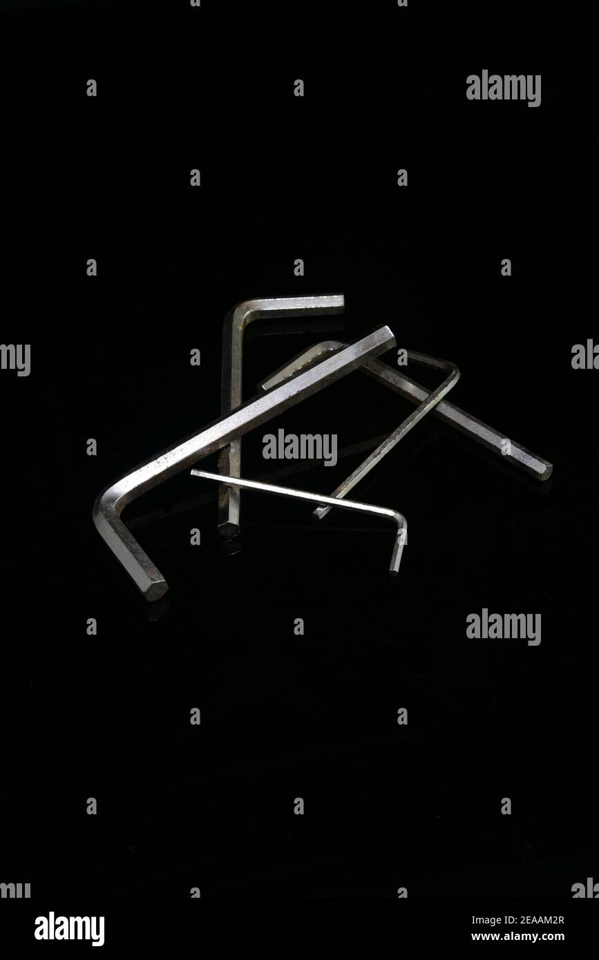 Allen keys with plain black background Stock Photo - Alamy
