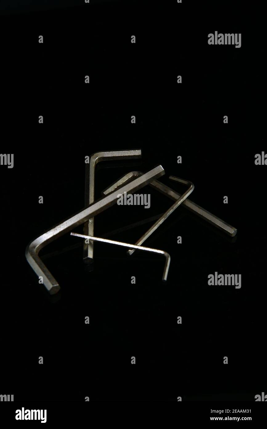 Allen keys with plain black background Stock Photo - Alamy