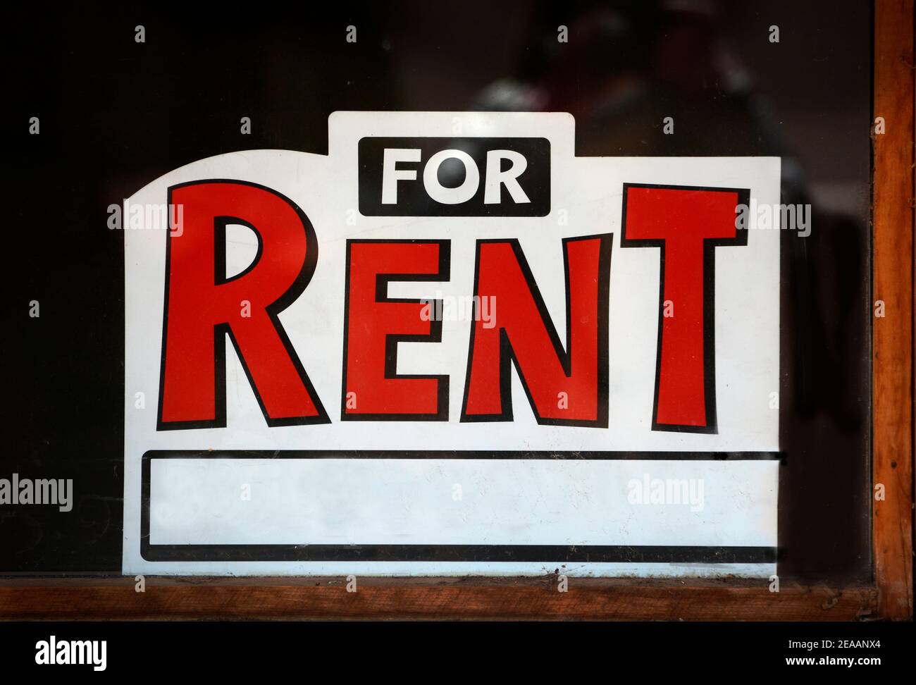 A "For Rent" sign on the door of a vacant business property in Santa Fe ...