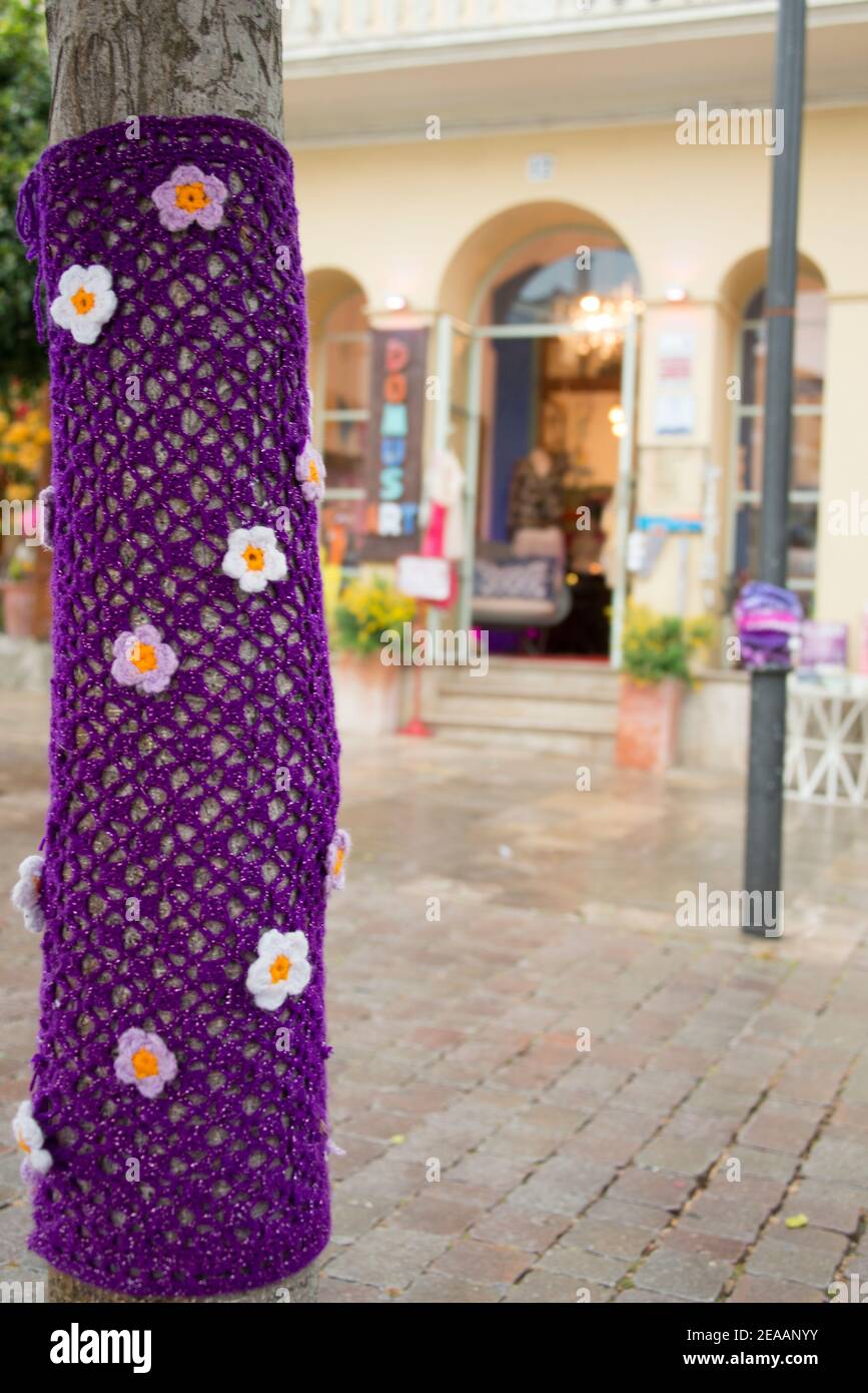 Tree trunk knitted with wool with floral ornament Stock Photo - Alamy
