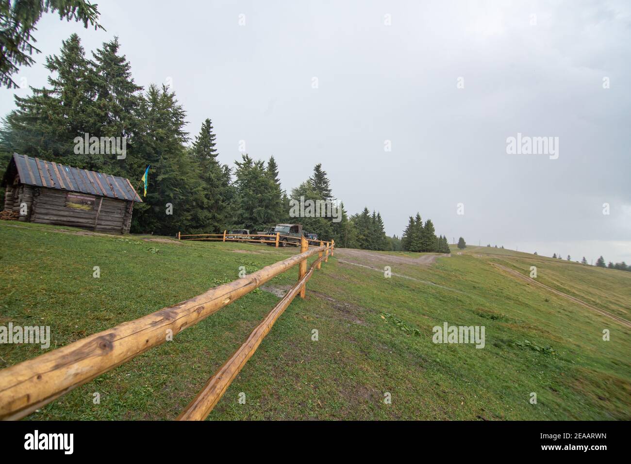 Wooden log huts of farm in mountain forest Stock Photo - Alamy