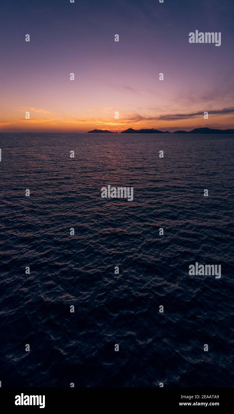 Scenic view of a calm sea with a beautiful sunset background Stock ...