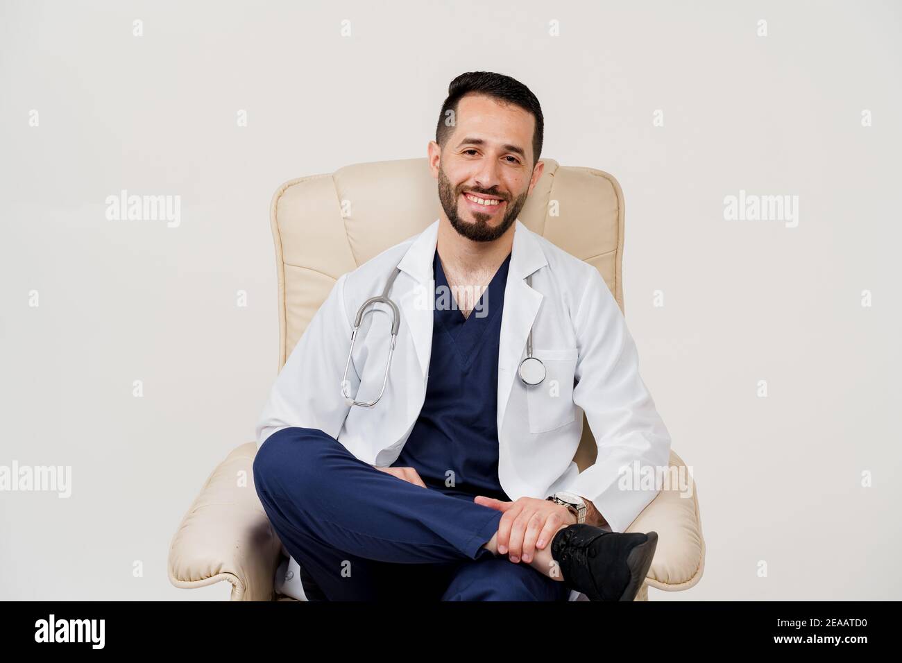 Arabian doctor surgeon in medical robe with phonendoscope seats and ...