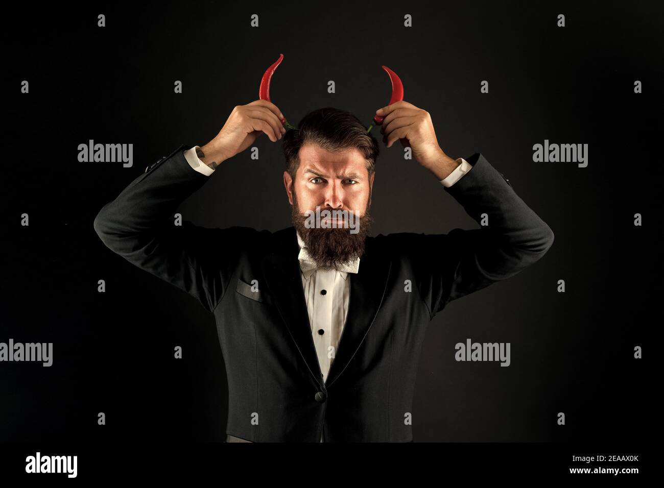 extra strong. Pepper harvest industry. peppery man with devil horns ...