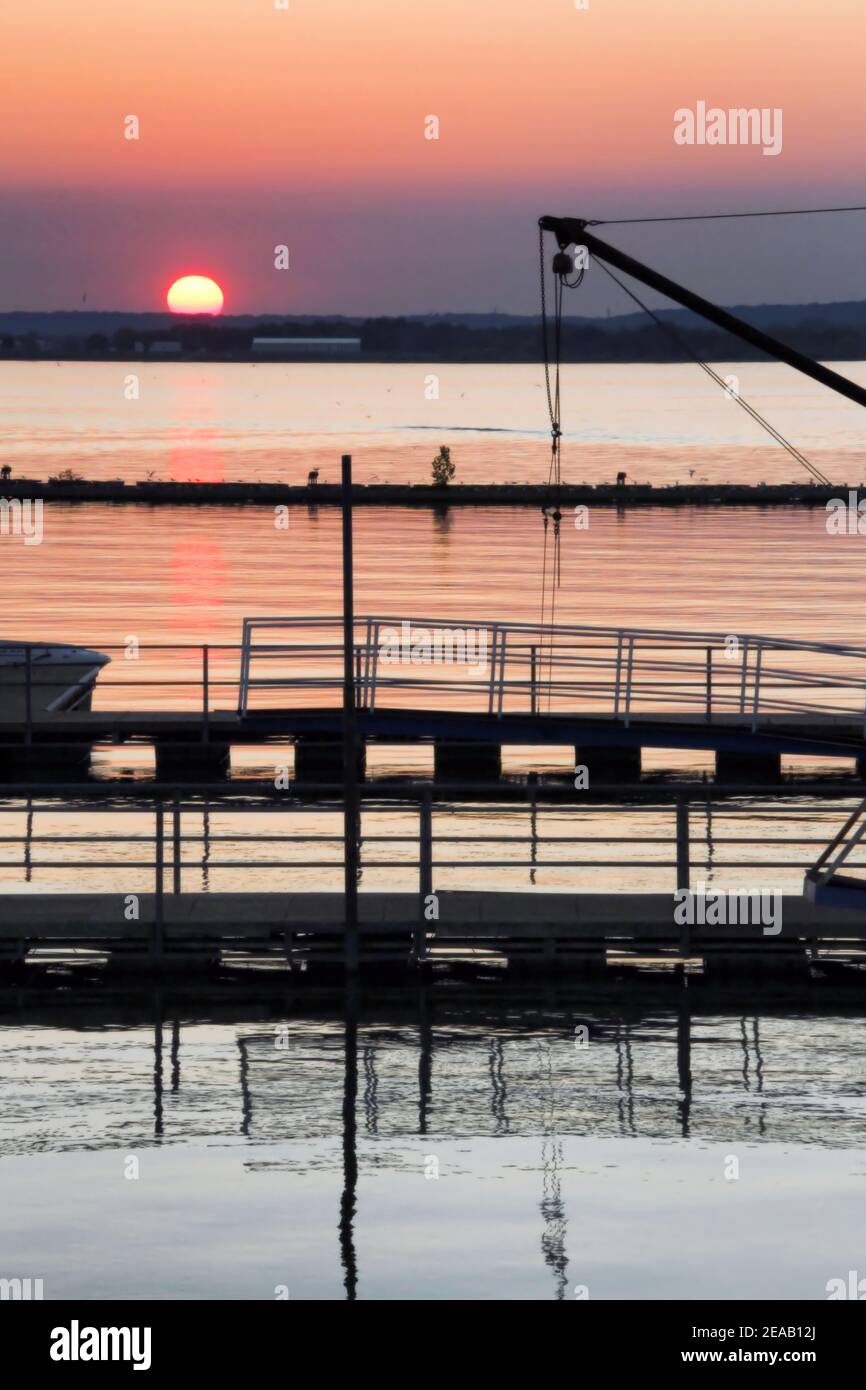 Looking out over Grand Lake from the shore through boat rigging and ...