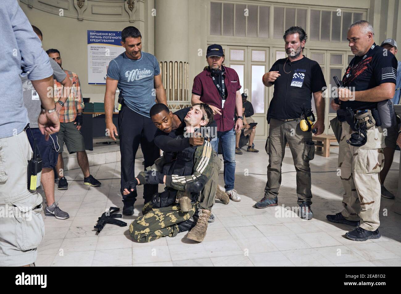 OUTSIDE THE WIRE, director Mikael Hafstrom (standing, center), Anthony ...