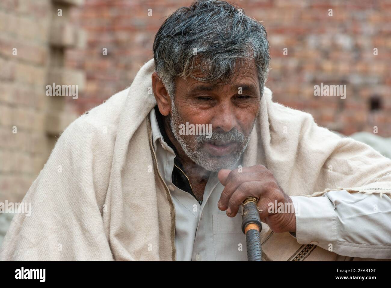 Man Smoking Hookah, Rural Life, Punjab, Pakistan Stock Photo - Alamy