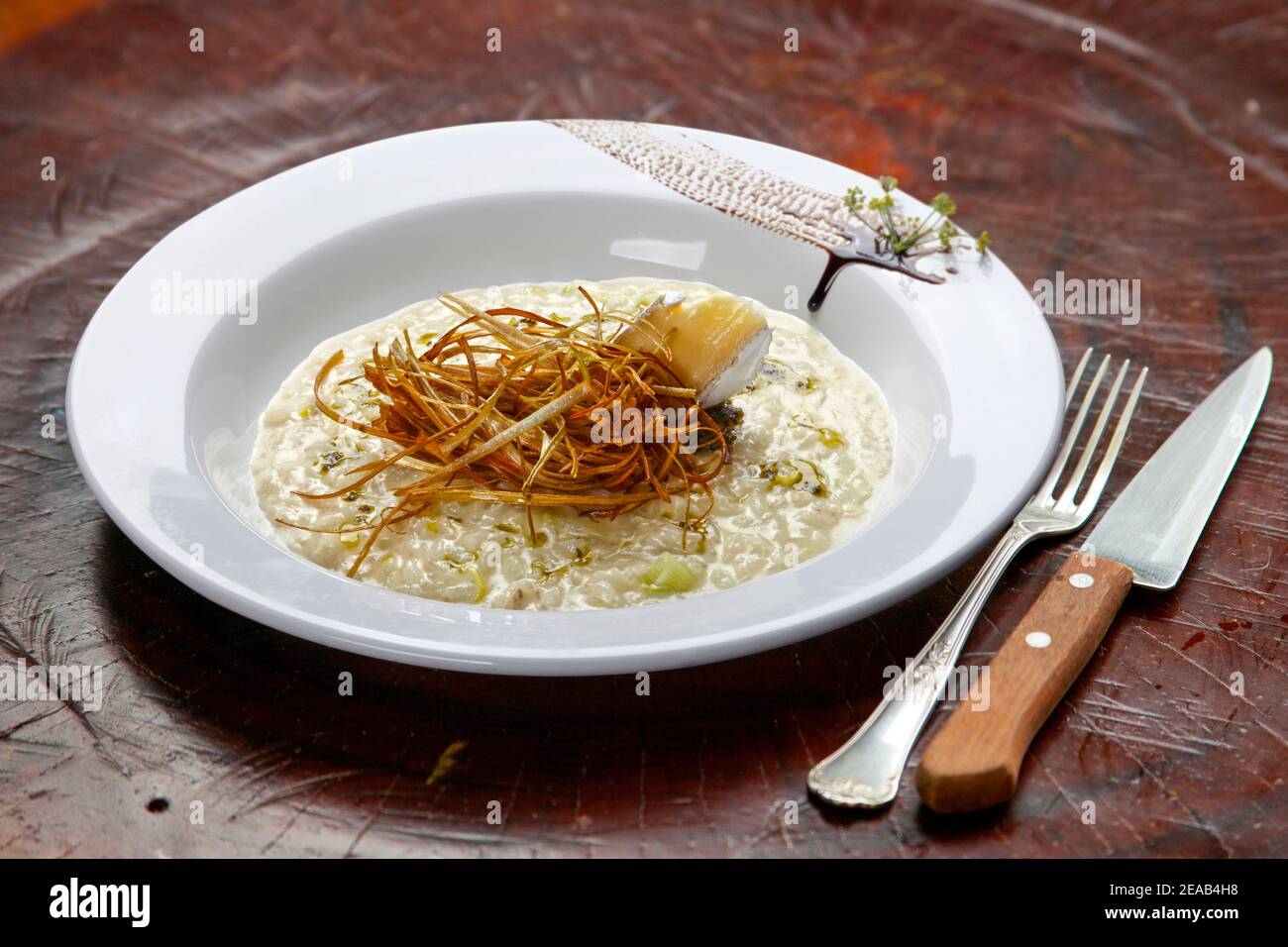 Risotto with brie cheese, italian food Stock Photo - Alamy