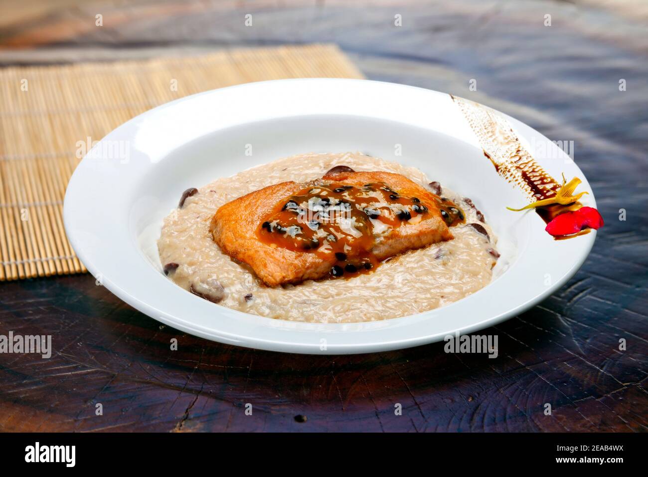 Risotto with grilled salmon fillet and passion fruit sauce Stock Photo ...