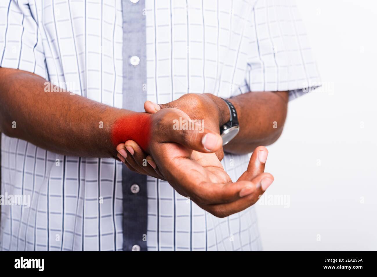 Closeup hand Asian black man holds his wrist hand injury, feeling pain ...