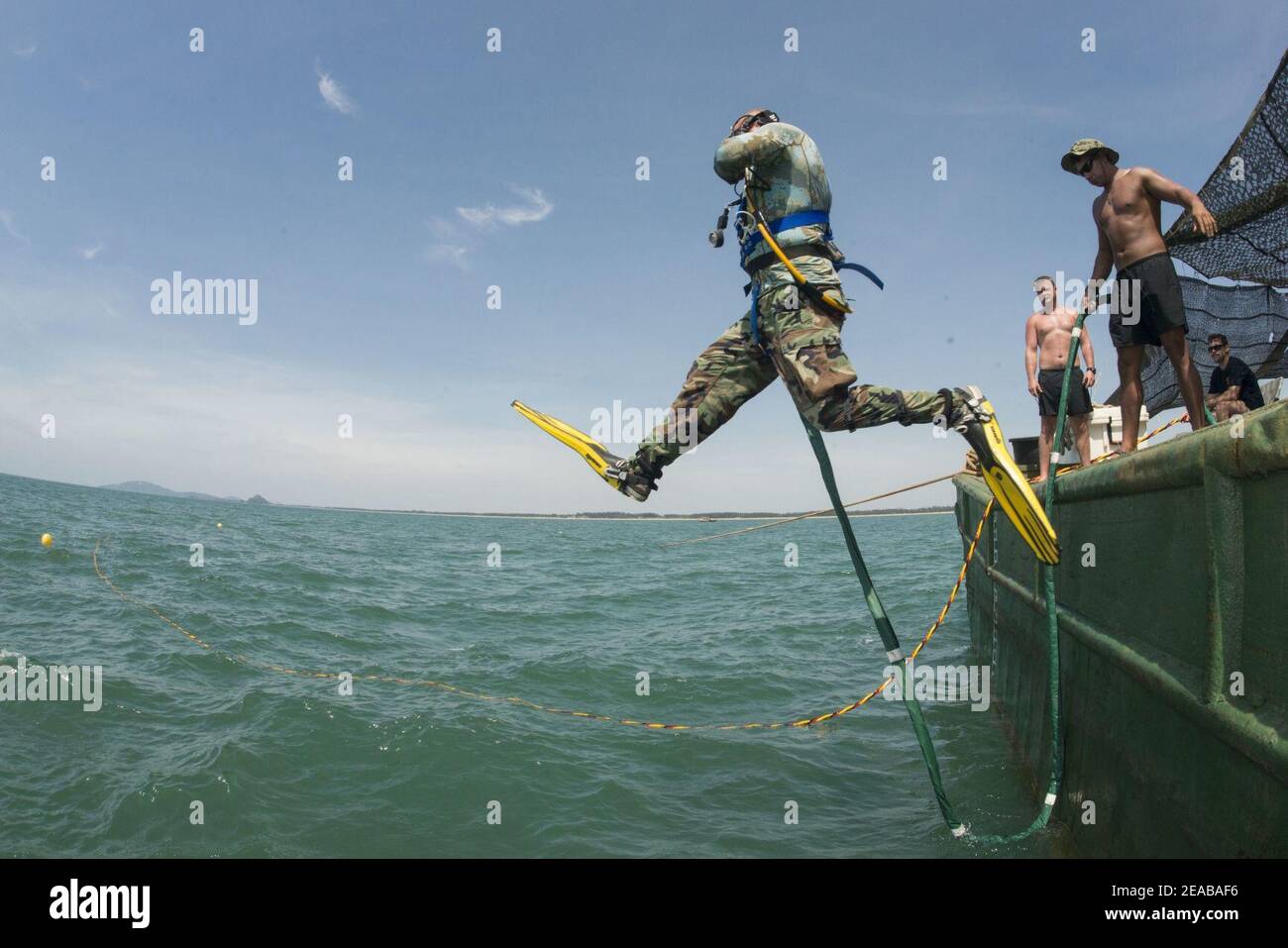 Navy diver enters water during POW-MIA recovery mission 150527 Stock ...