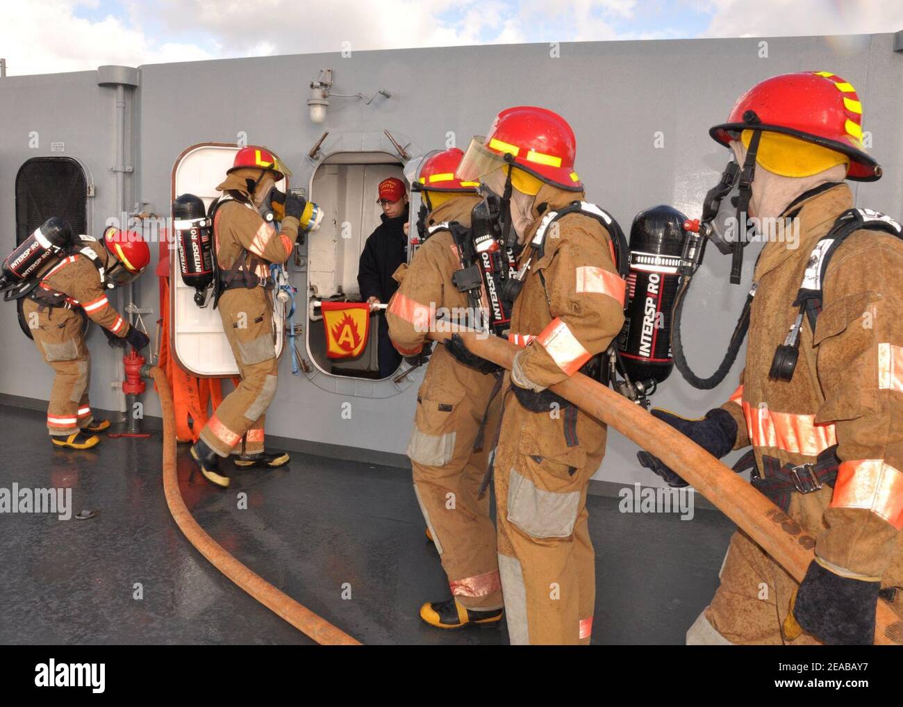 Navy firefighters train Stock Photo - Alamy