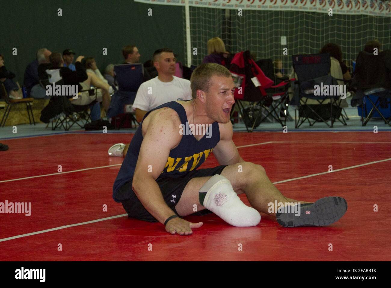 Navy Hospital Corpsman Max Rohn encourages teammates during a game of ...
