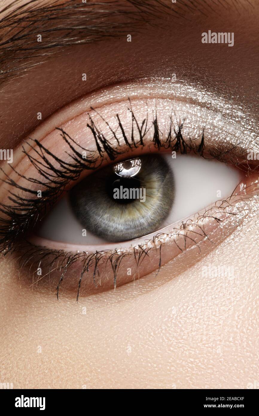 Beautiful macro of female eye with classic clean makeup. Perfect shape ...