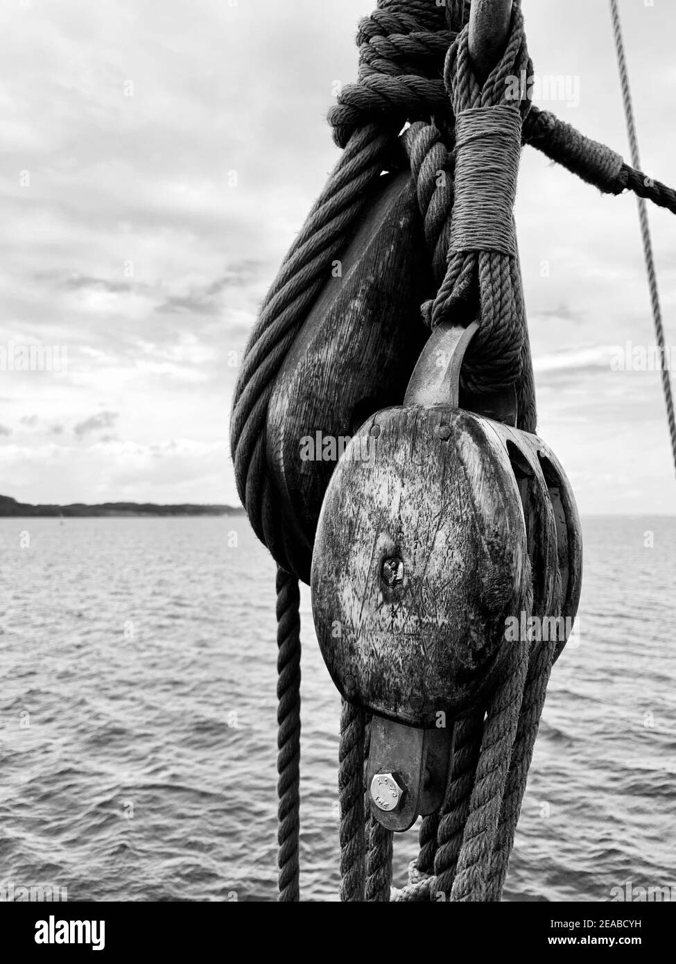Wooden ship blocks braced with ropes on the historic merchant ship Lisa ...