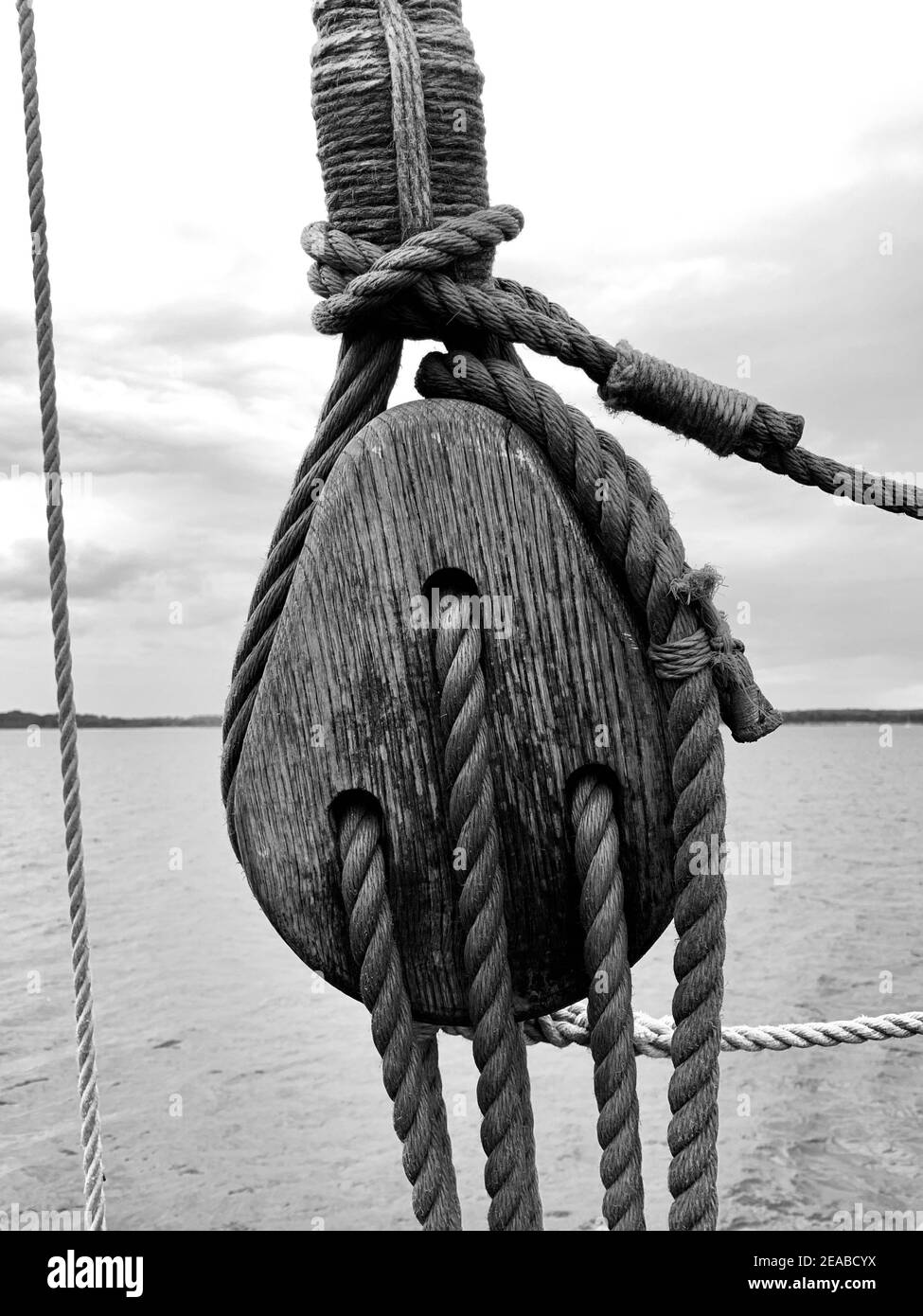 Wooden block of ships braced with ropes on the historical merchant ship ...