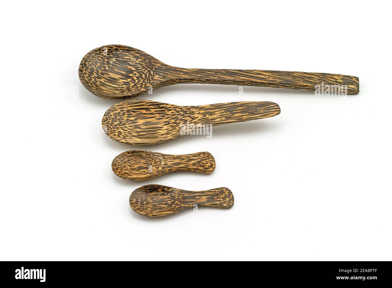 Manny wooden spoon isolated on white background Stock Photo - Alamy