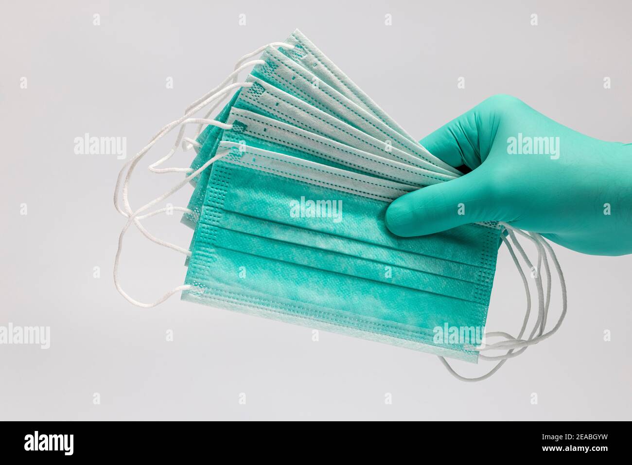 Doctor holds several mouth nasal protective masks in his hand hi-res ...