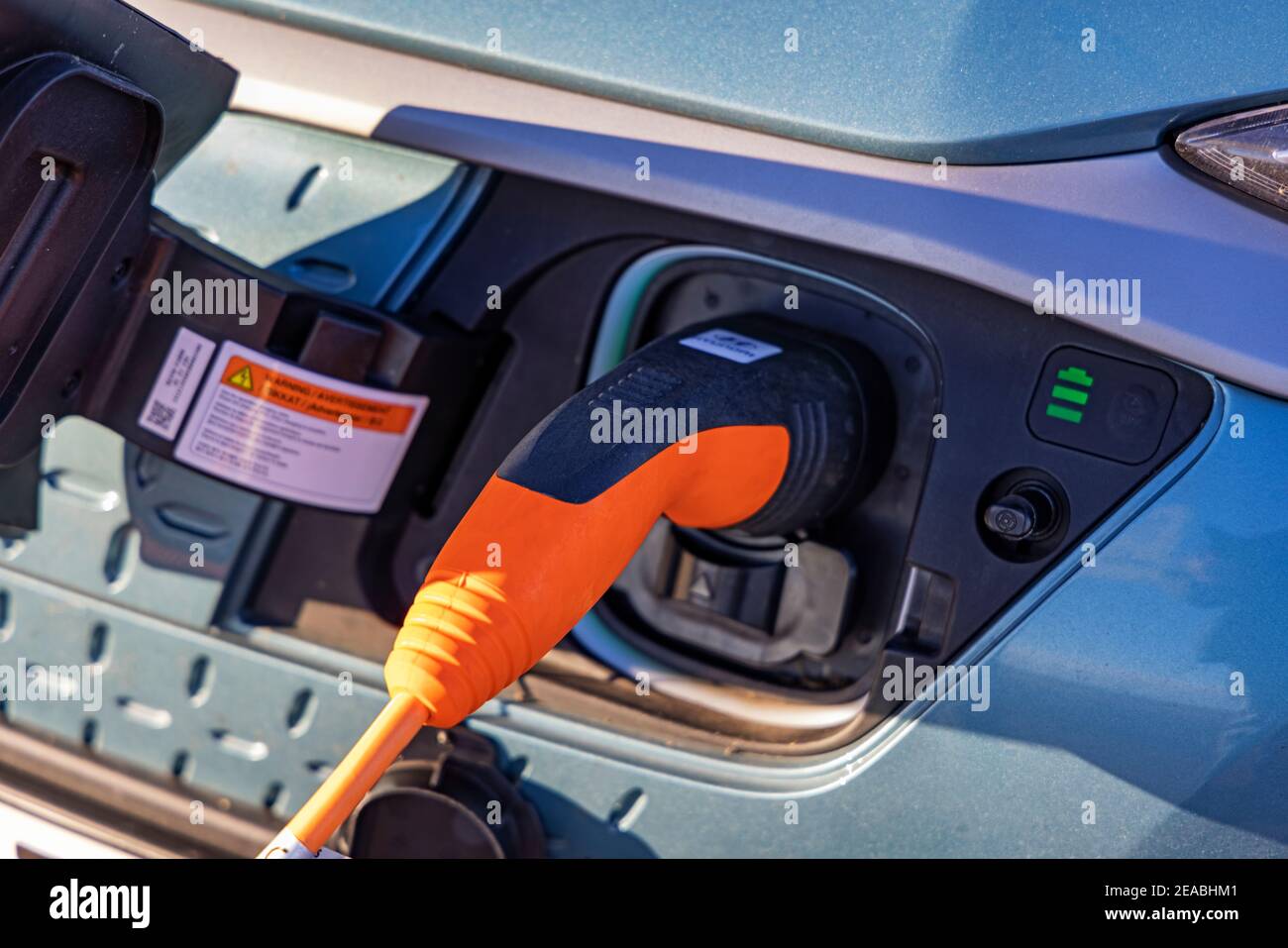 Electric car when charging, detail, loading flap, charging plug ...