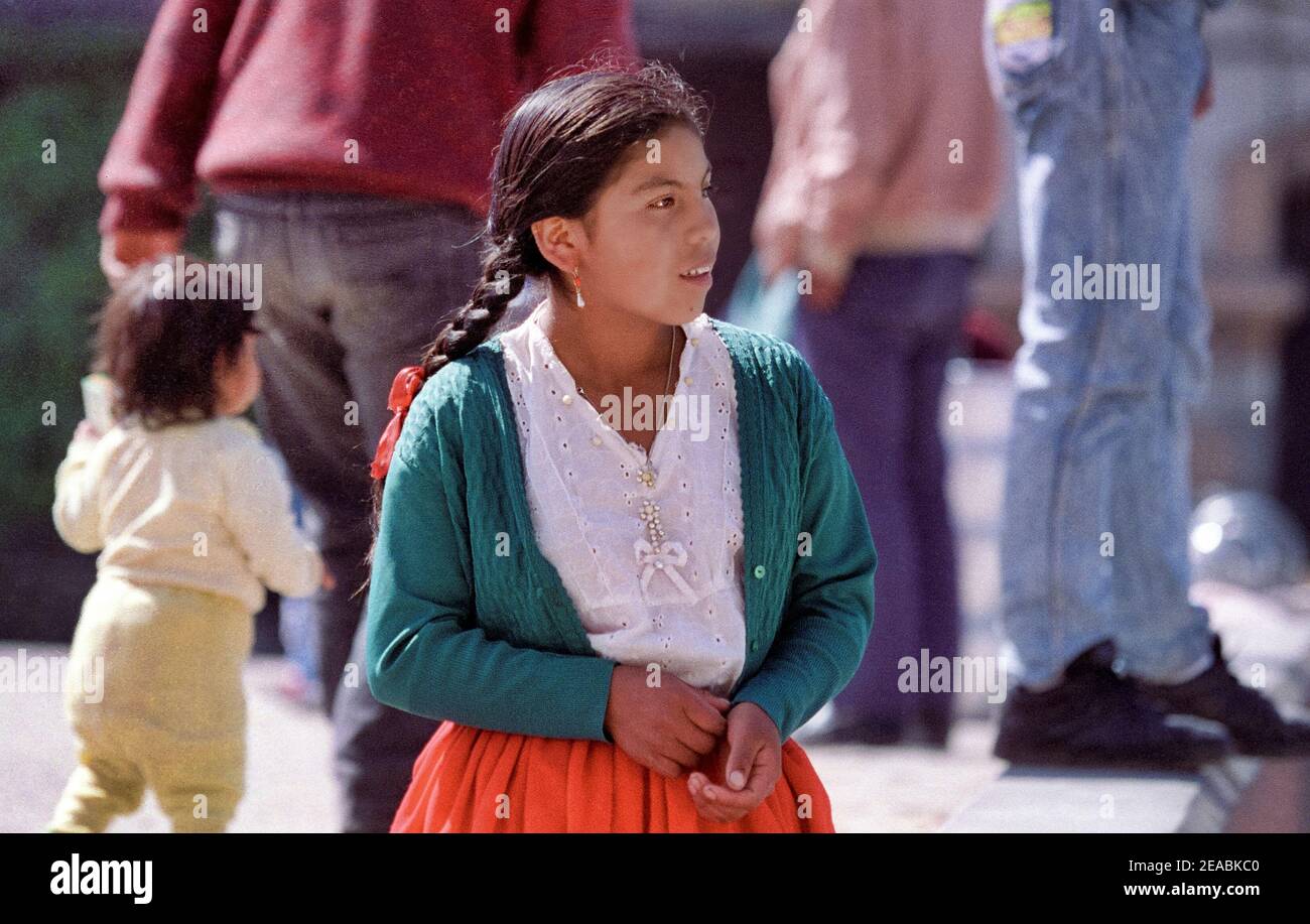 Native woman in a market square in Cuenca, Ecuador Stock Photo - Alamy