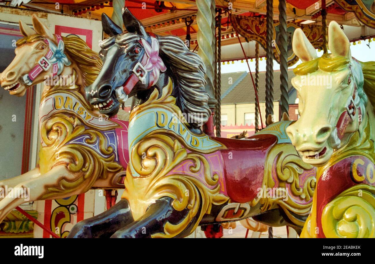 Wooden horses on a traditional roundabout Stock Photo - Alamy