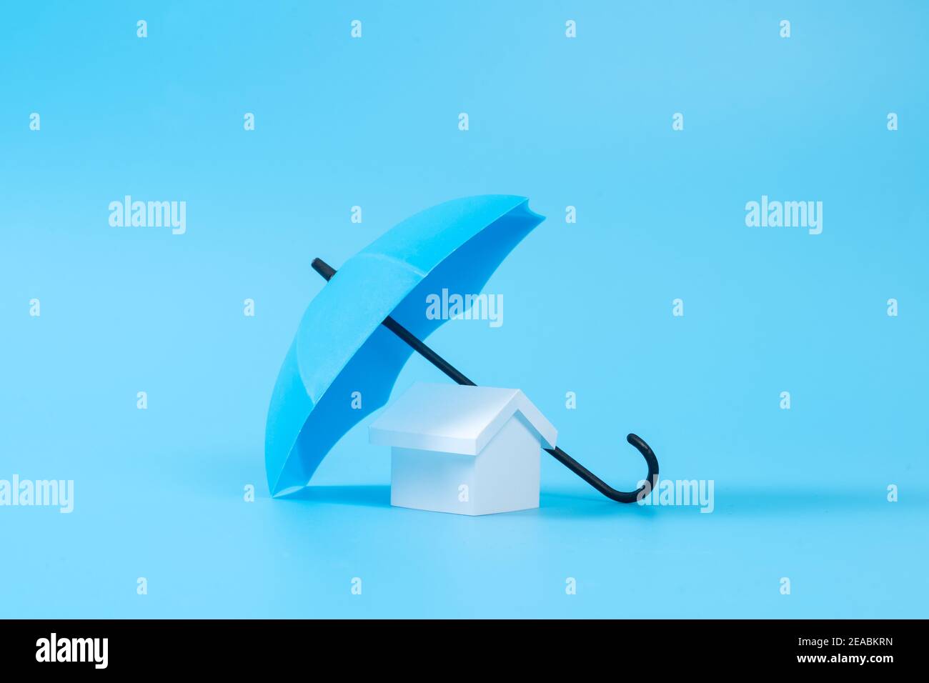 House model under blue color umbrella Stock Photo - Alamy