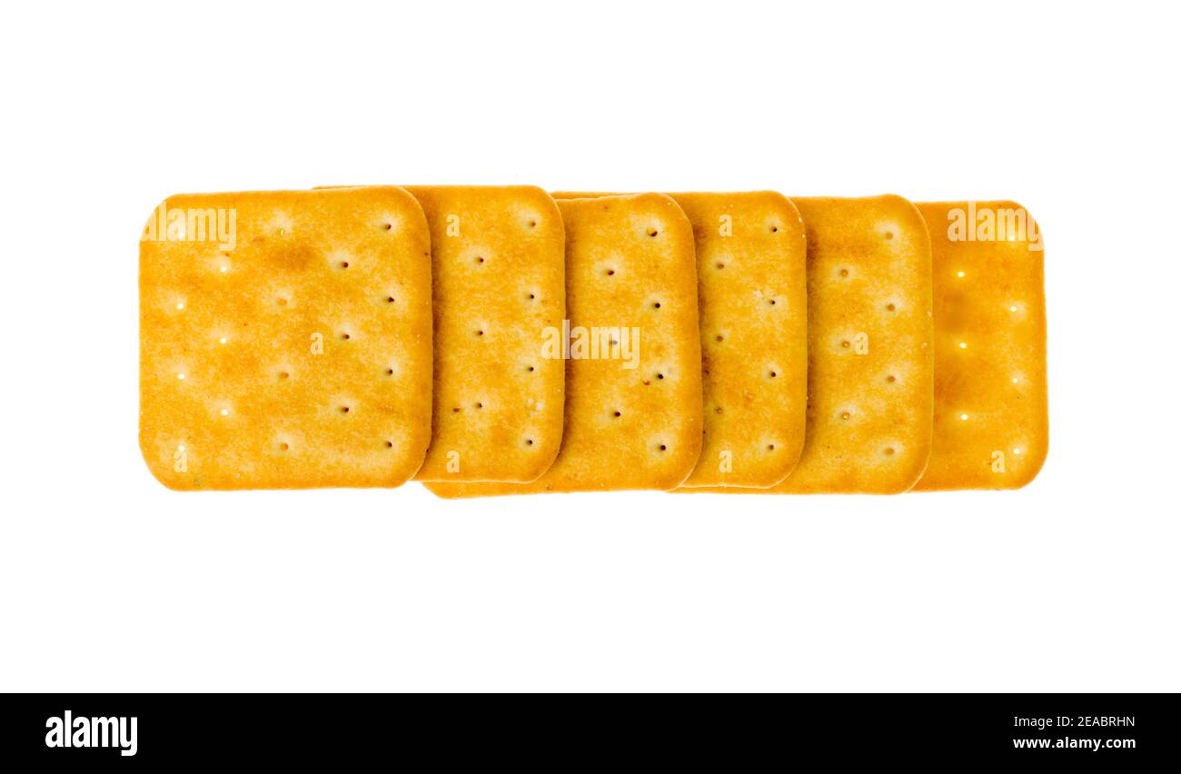 Delicious golden salt cracker cookies isolated on white background ...