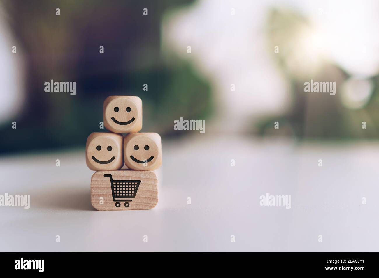 Smile face and cart icon on wooden cube. Optimistic person or people ...