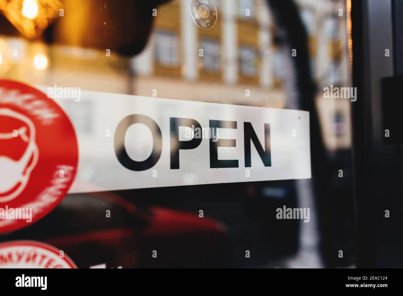 Signboard with Open text at the cafe through glass window Stock Photo ...