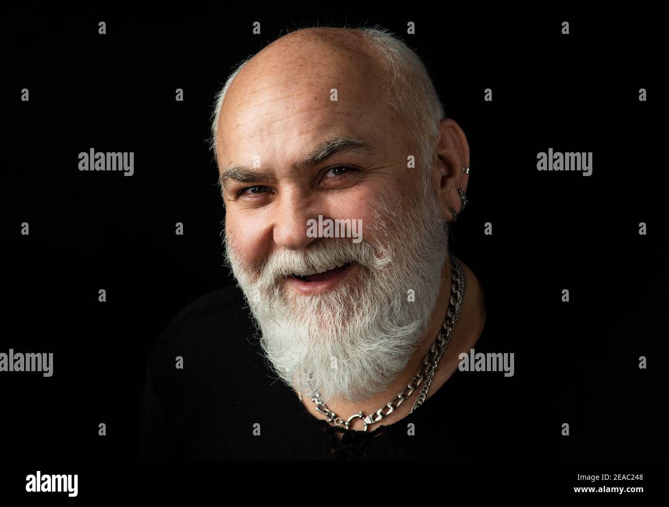 Happy retirement. Close up portrait of senior smiling pensioner looking at camera. Old Man ...