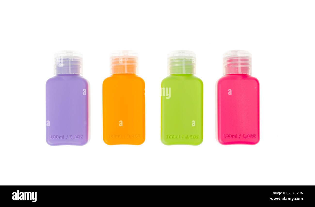 Multi-colored plastic bottles, containers isolated on white background ...