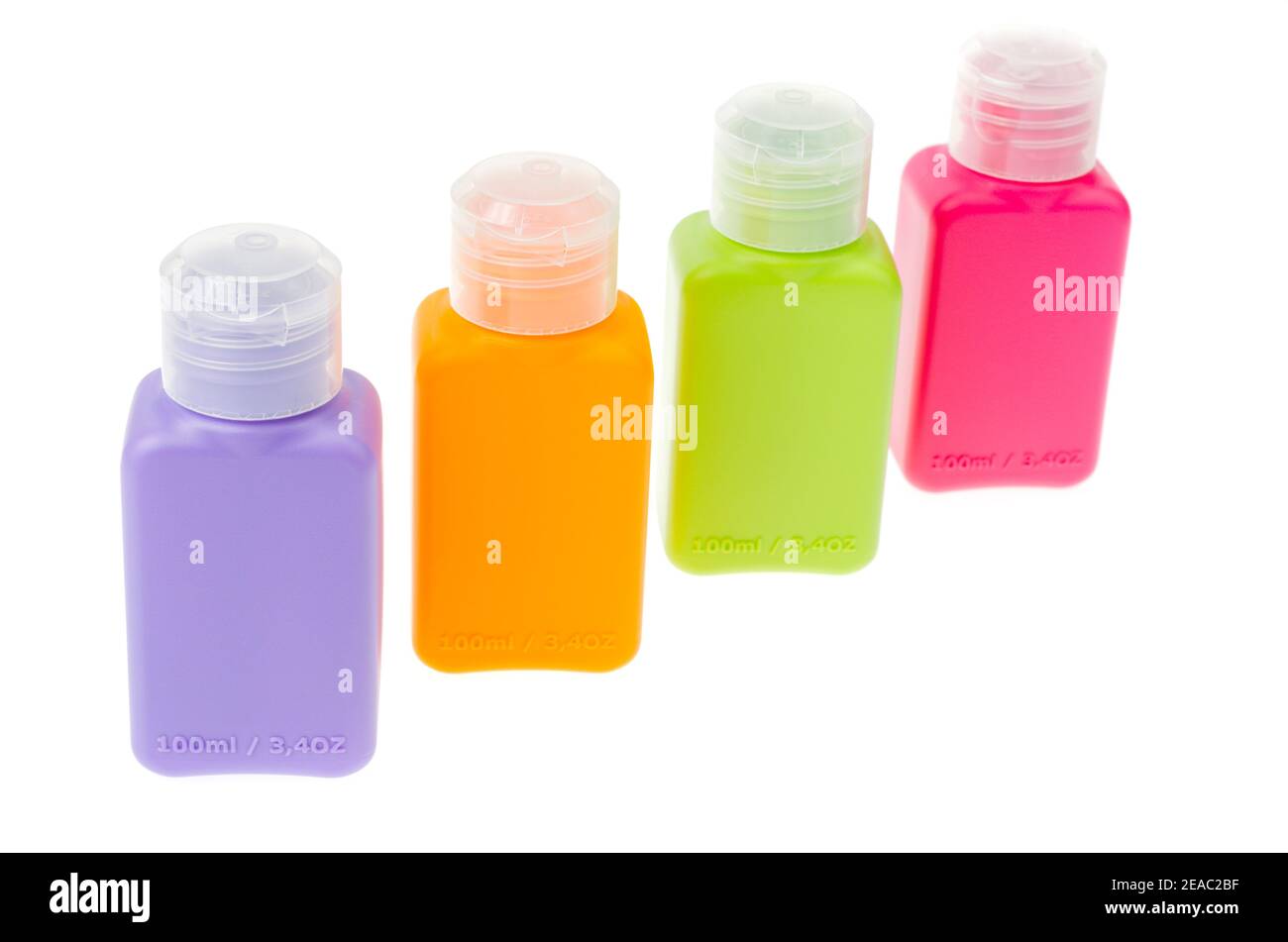 Multi-colored plastic bottles, containers isolated on white background ...
