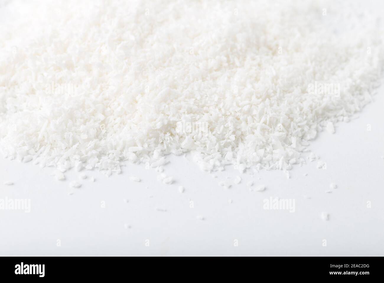Fresh coconut flakes white background Stock Photo - Alamy