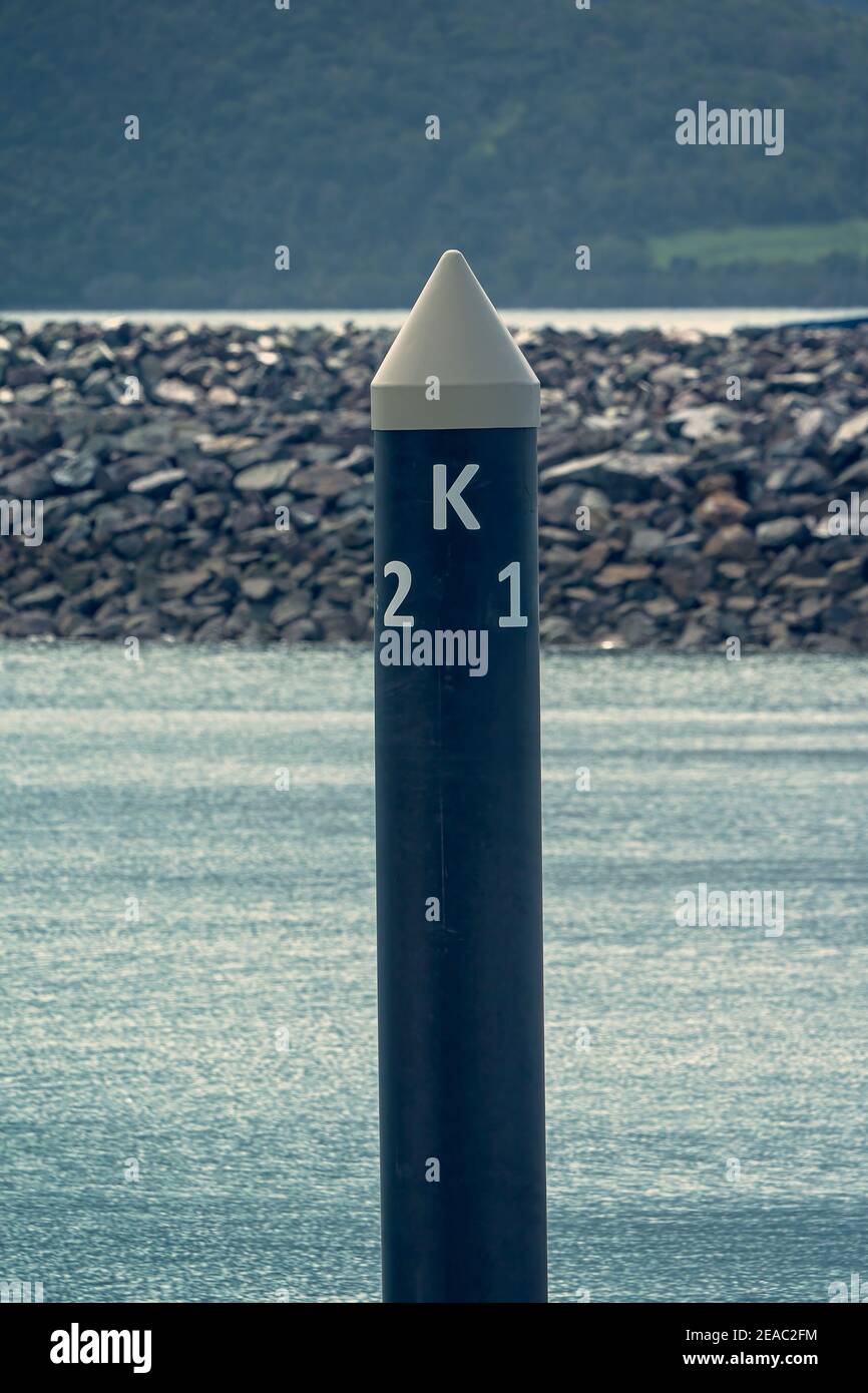 A marina post indicating the berth number for boats Stock Photo - Alamy