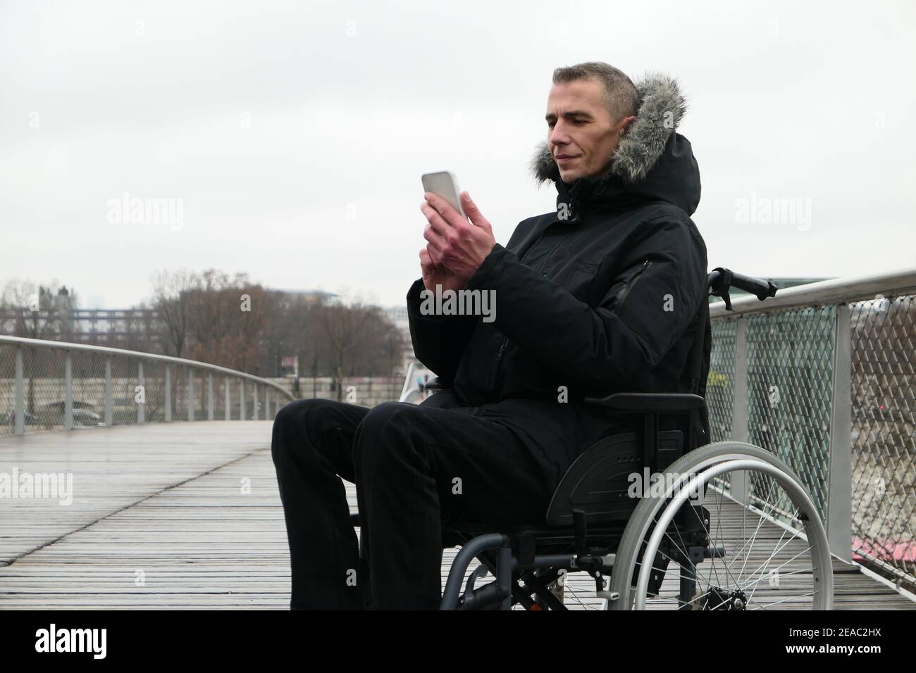Concept of disabled person. Man in a wheelchair outside in the street ...