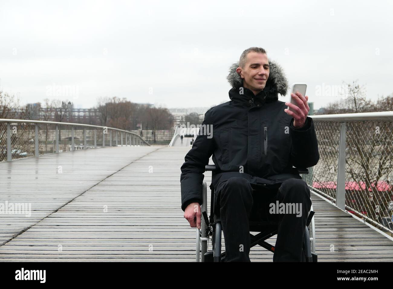 Concept of disabled person. Man in a wheelchair outside in the street ...