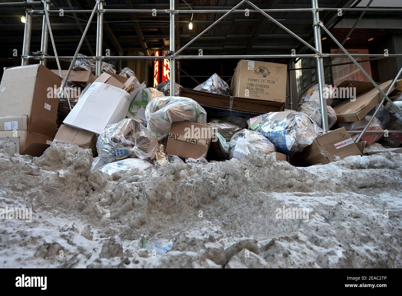 Piles of uncollected garbage seen in lower Manhattan, after two snow ...