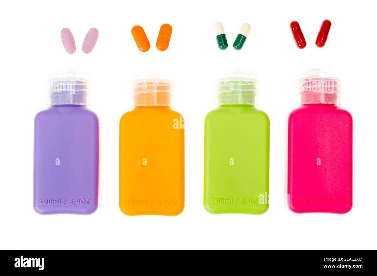 Multi-colored plastic bottles, containers with pills and capsules ...