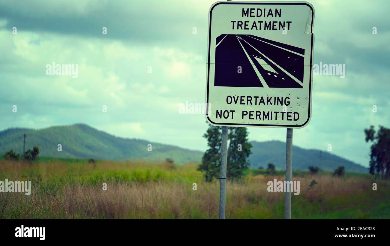 Median Treatment Overtaking Not Permitted road signage Stock Photo - Alamy