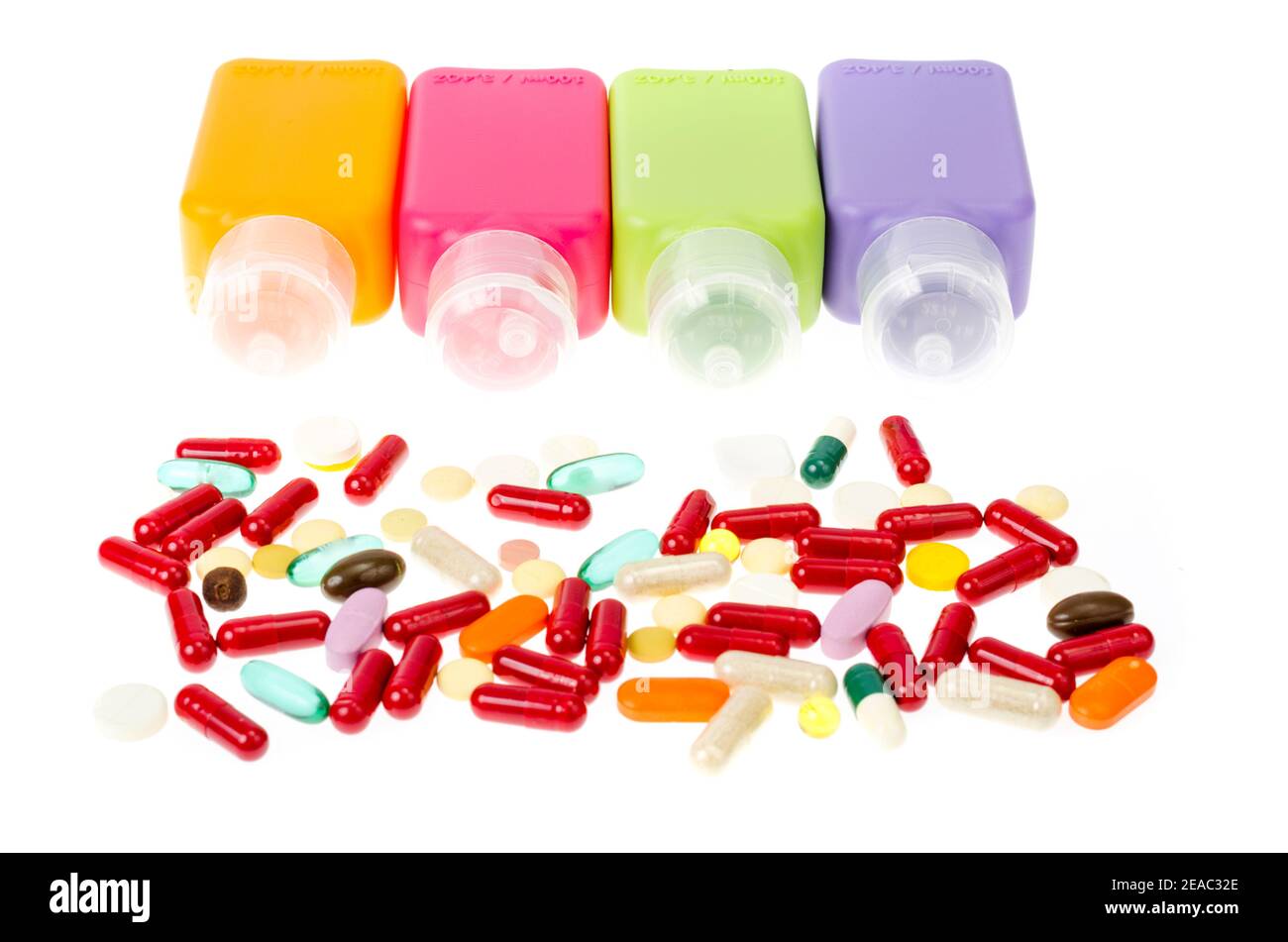 Multi-colored plastic bottles, containers with pills and capsules ...