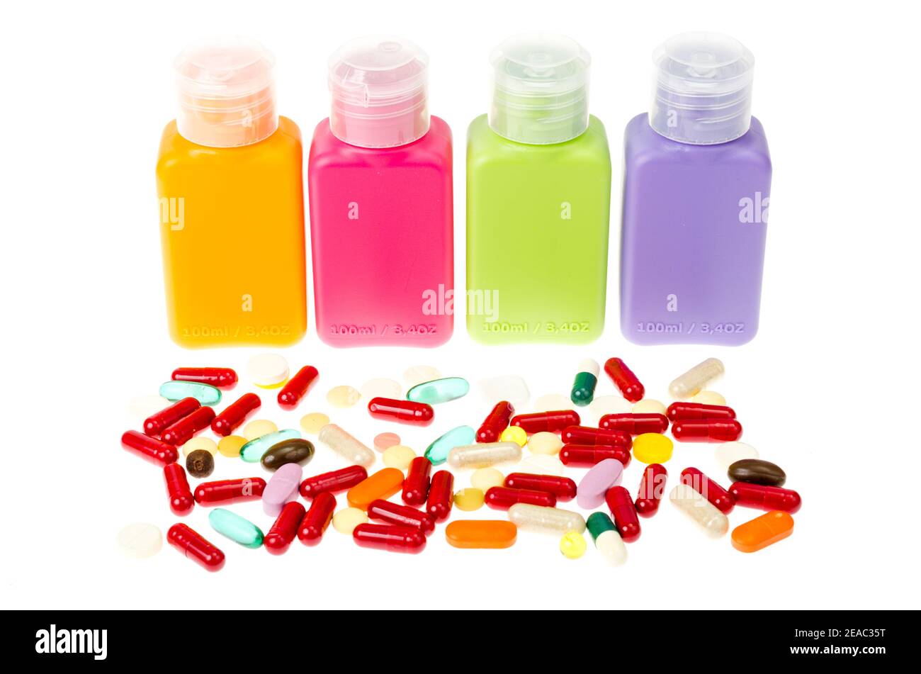 Multi-colored plastic bottles, containers with pills and capsules ...