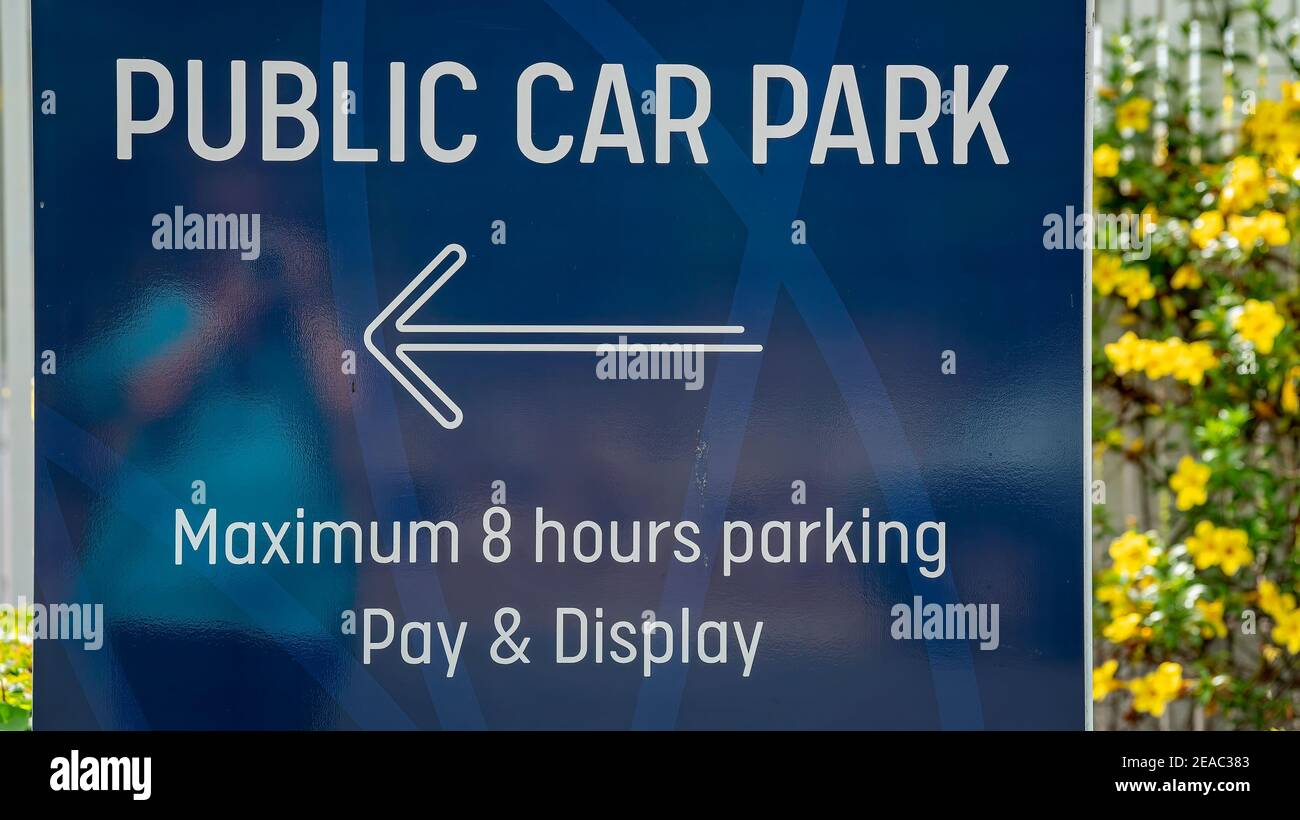 Public car park signage indicating number of hours and pay details ...