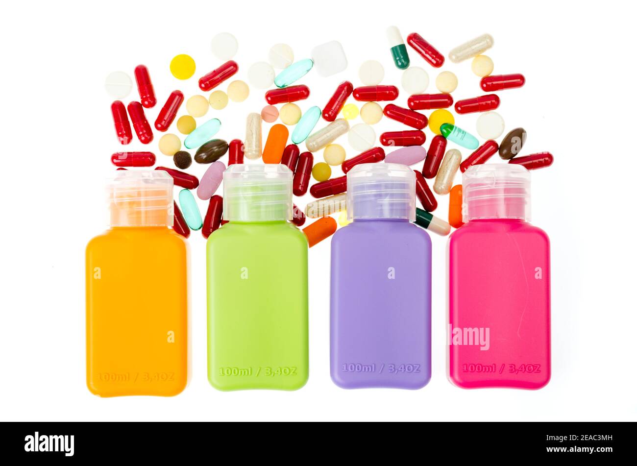 Multi-colored plastic bottles, containers with pills and capsules ...