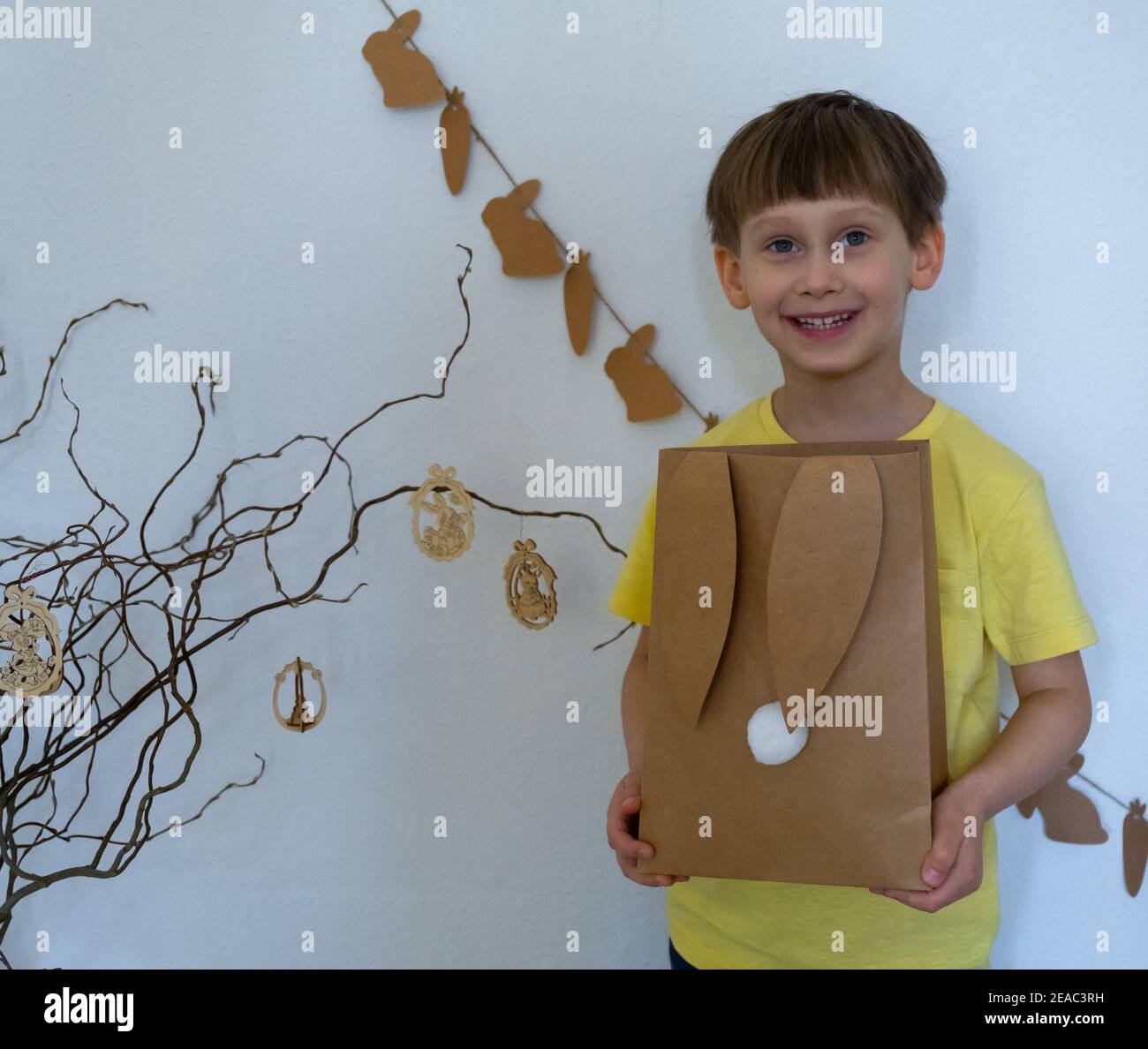 Happy easter. Boy holding easter gift Stock Photo - Alamy