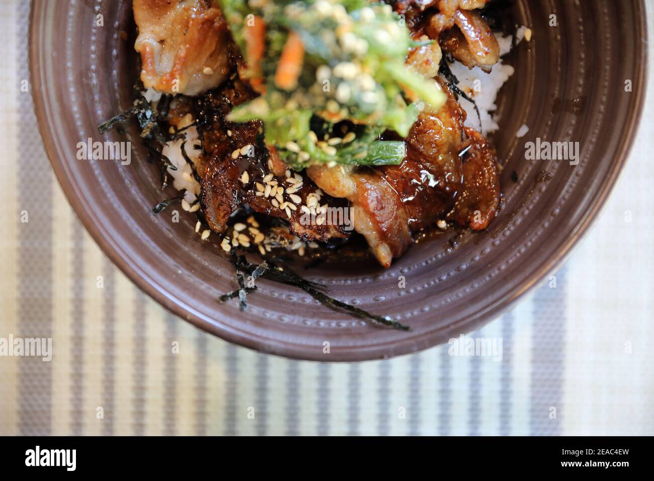 Grilled pork bowl japanese buta donburi on wood background Stock Photo ...