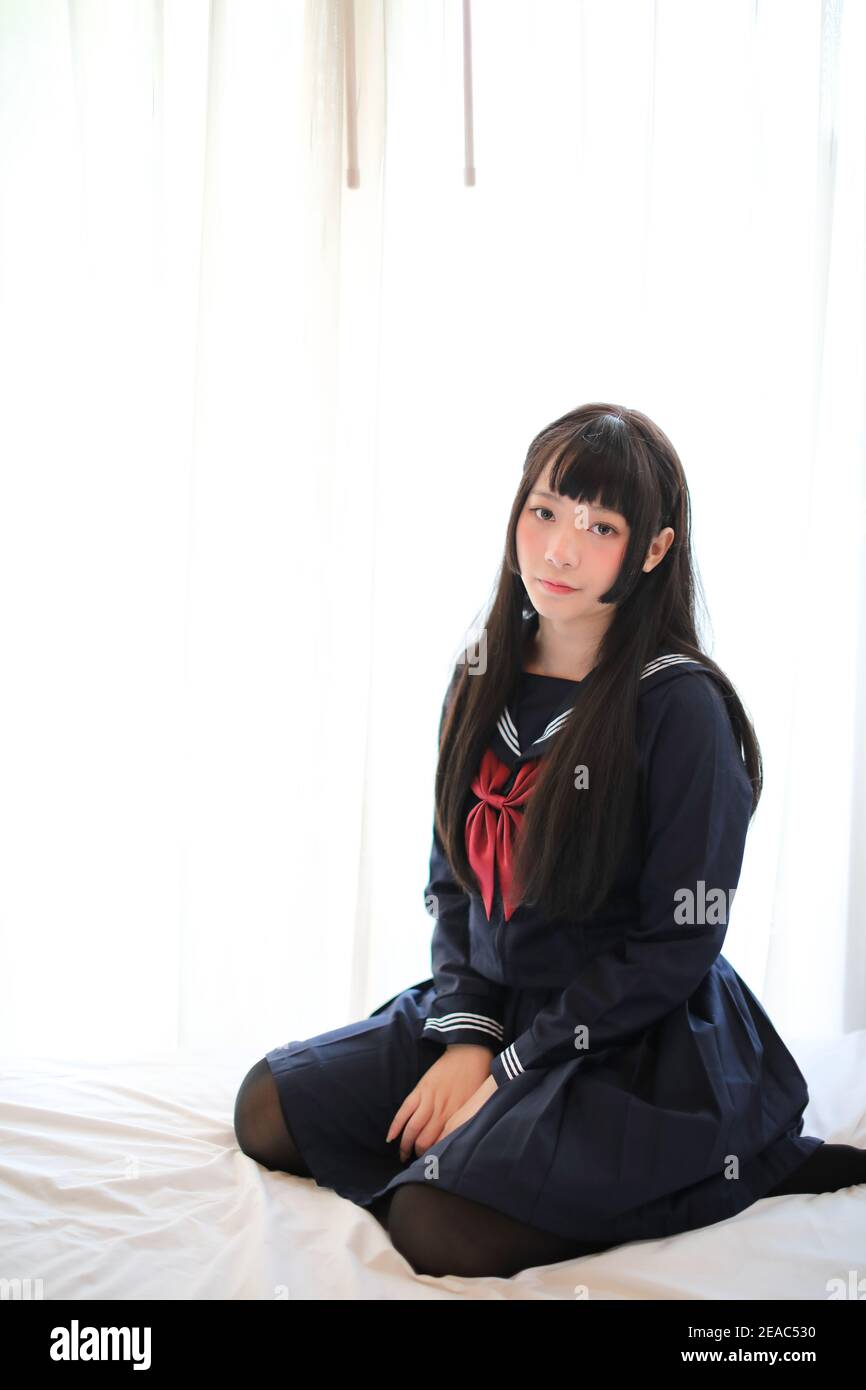 Portrait japanese school girl in white tone bed room Stock Photo - Alamy