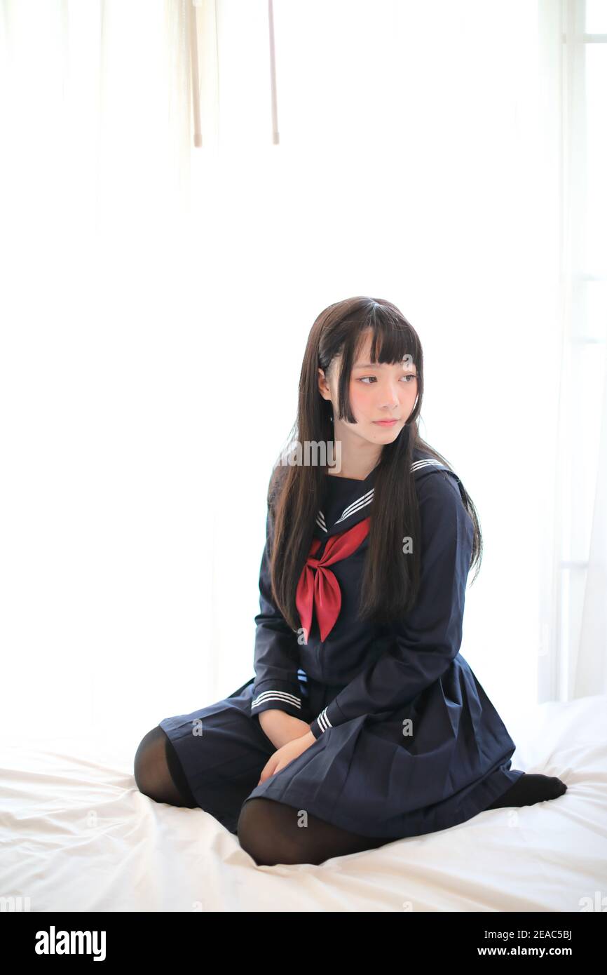 Portrait japanese school girl in white tone bed room Stock Photo - Alamy
