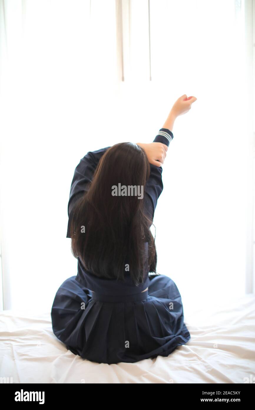 Portrait japanese school girl in white tone bed room Stock Photo - Alamy