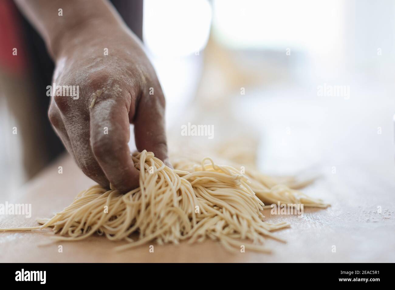 Making Handmade Noodles on wood background Stock Photo - Alamy