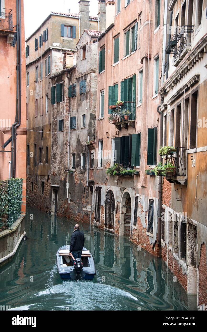 Man in the boat, Venice Stock Photo - Alamy